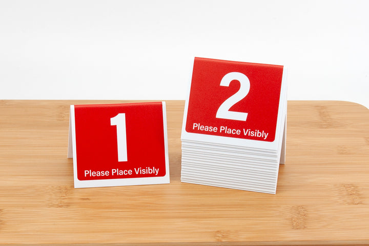 Manufacturer of table numbers, sign riders and small table top signage ...